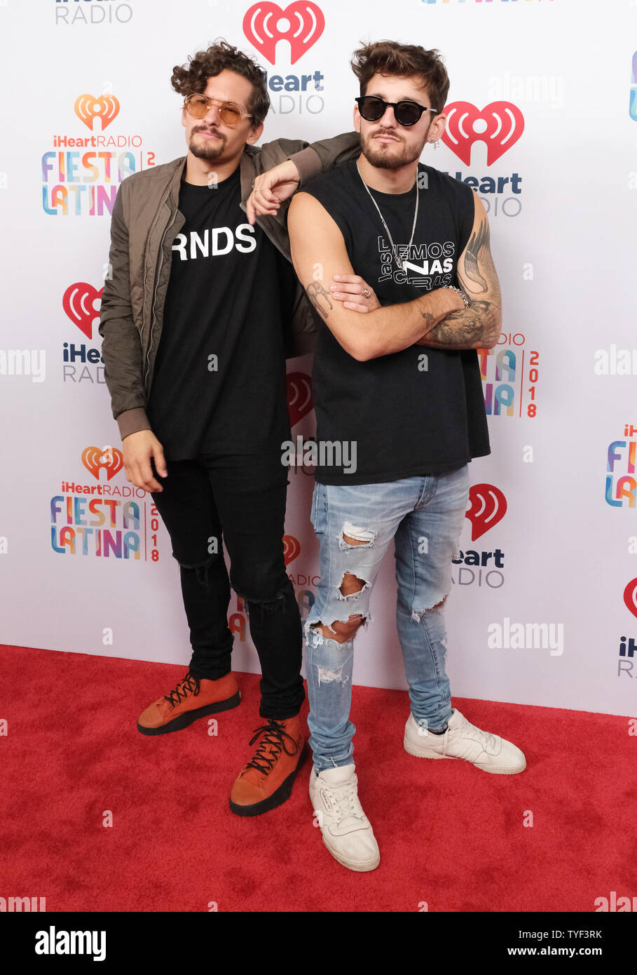 May & Ricky walks the red carpet at the IHeartRadio Fiesta Latina 2018 ...
