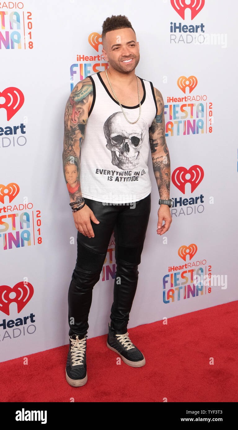 Nacho walks the red carpet at the IHeartRadio Fiesta Latina 2018 ...