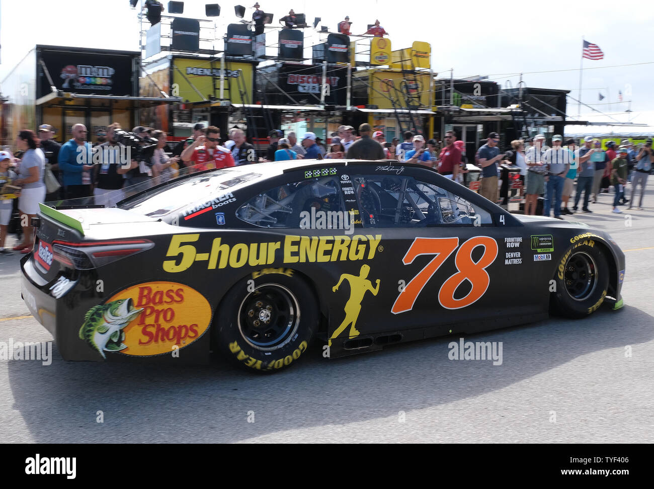 Martin Truex Jr (78) heads to the track from the garage area during ...