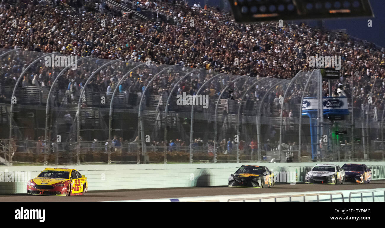 Joey Logano (22) leading the pack during a race restart in the NASCAR ...