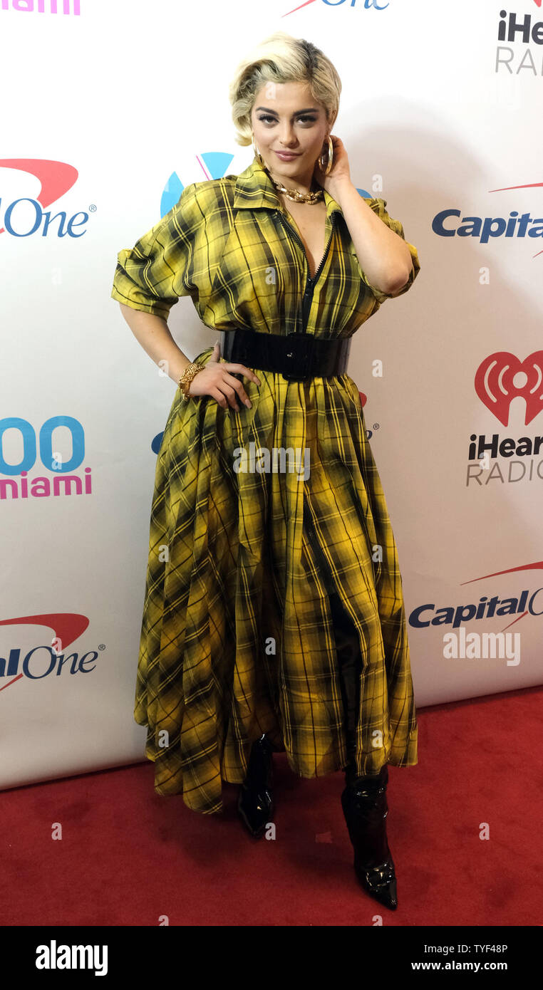 Bebe Rexha walks the red carpet at the Y100 iHeartRadio Jingle Ball ...