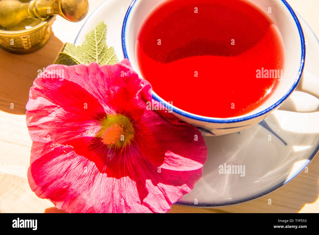 mallow tea, cup with mallow flower and mortar Stock Photo - Alamy