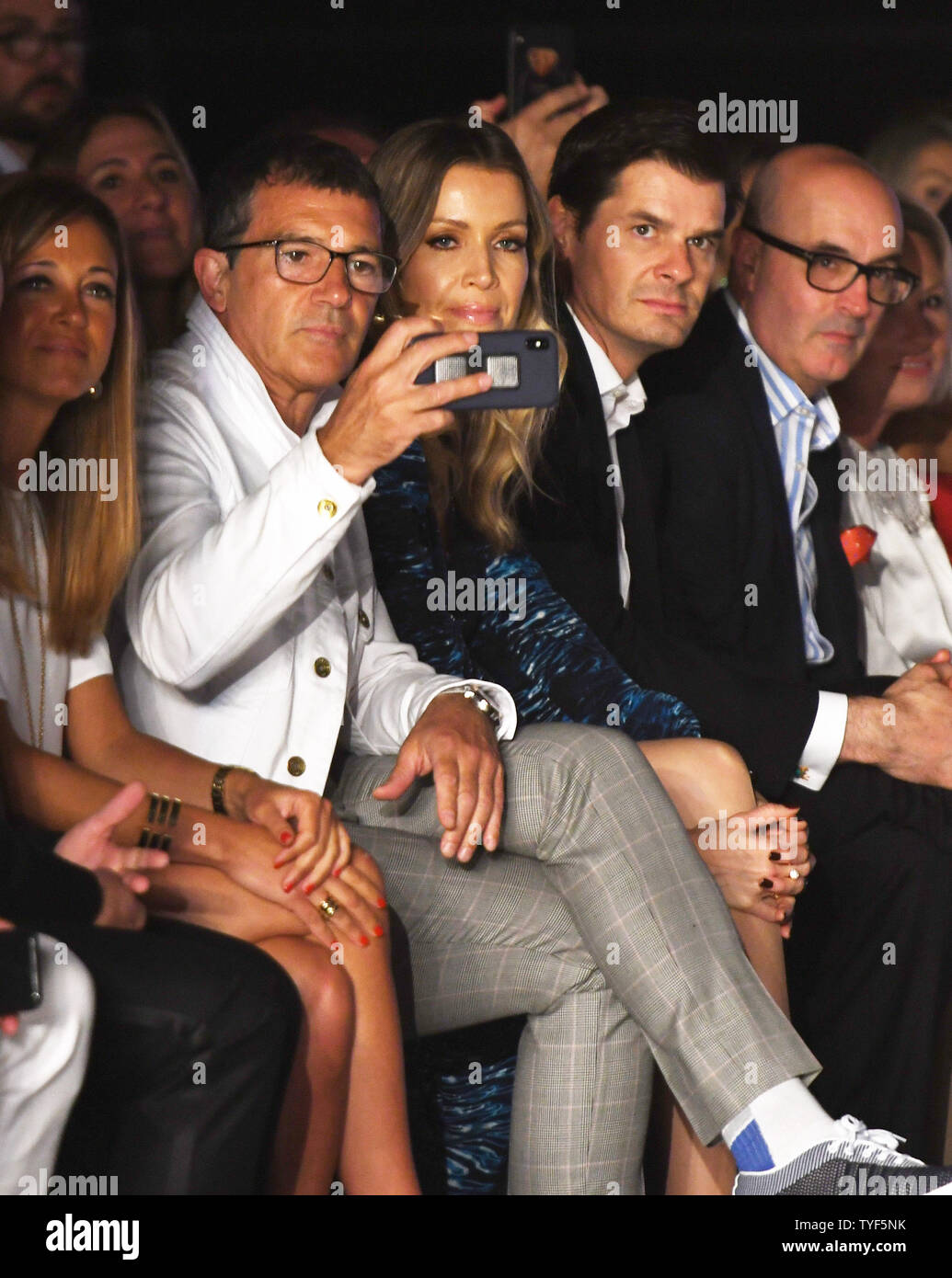 Honorary president of Miami Fashion Antonio Banderas sits with his wife ...