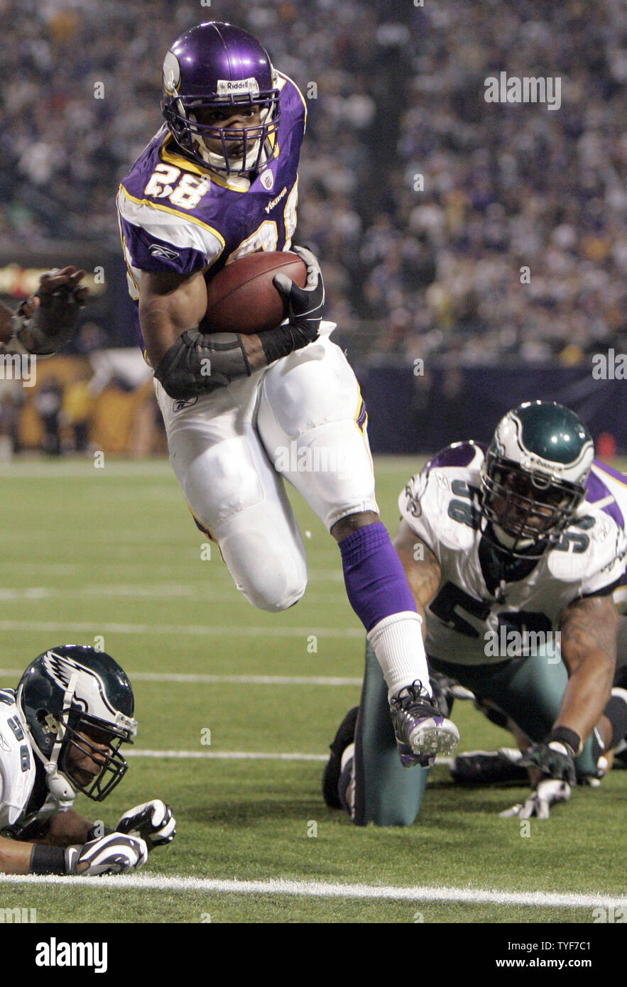 Minnesota Vikings running back Adrian Peterson (28) leaps into the ...