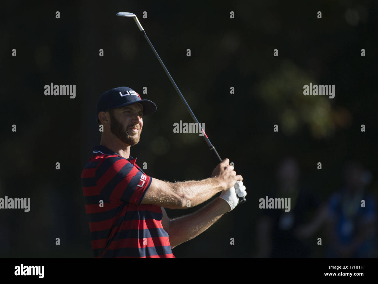 USA team member Dustin Johnson watches his drive off of the 16th tee ...