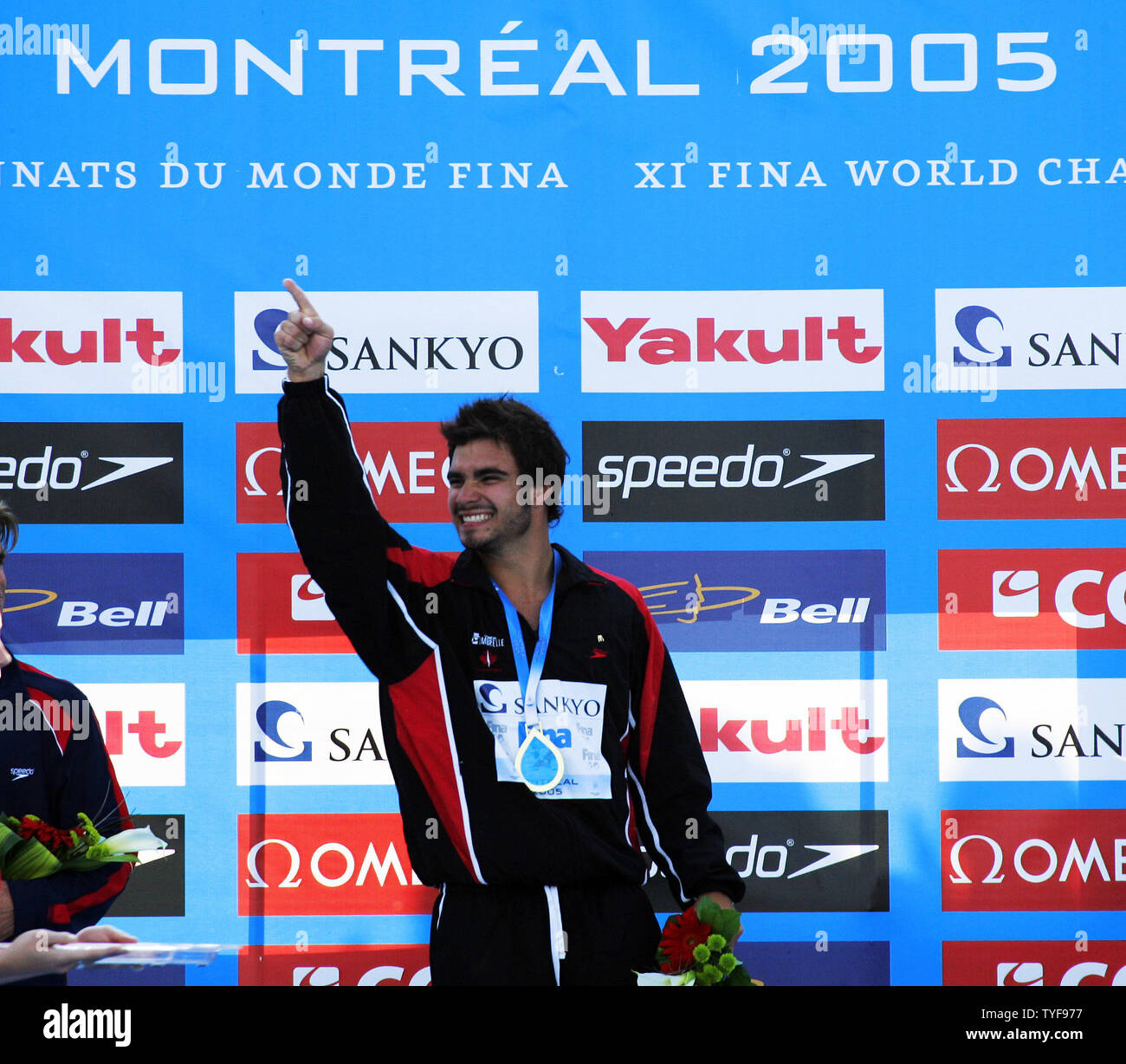 Hometown favorite diver Alexandre Despatie celebrates his victory in ...