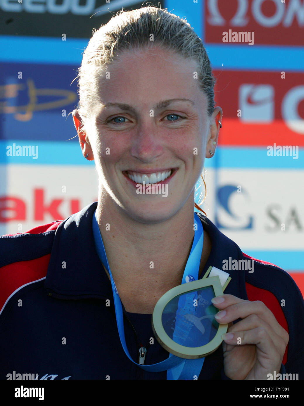 American diver Laura Wilkinson, of Spring, Tex., brandishes her gold ...