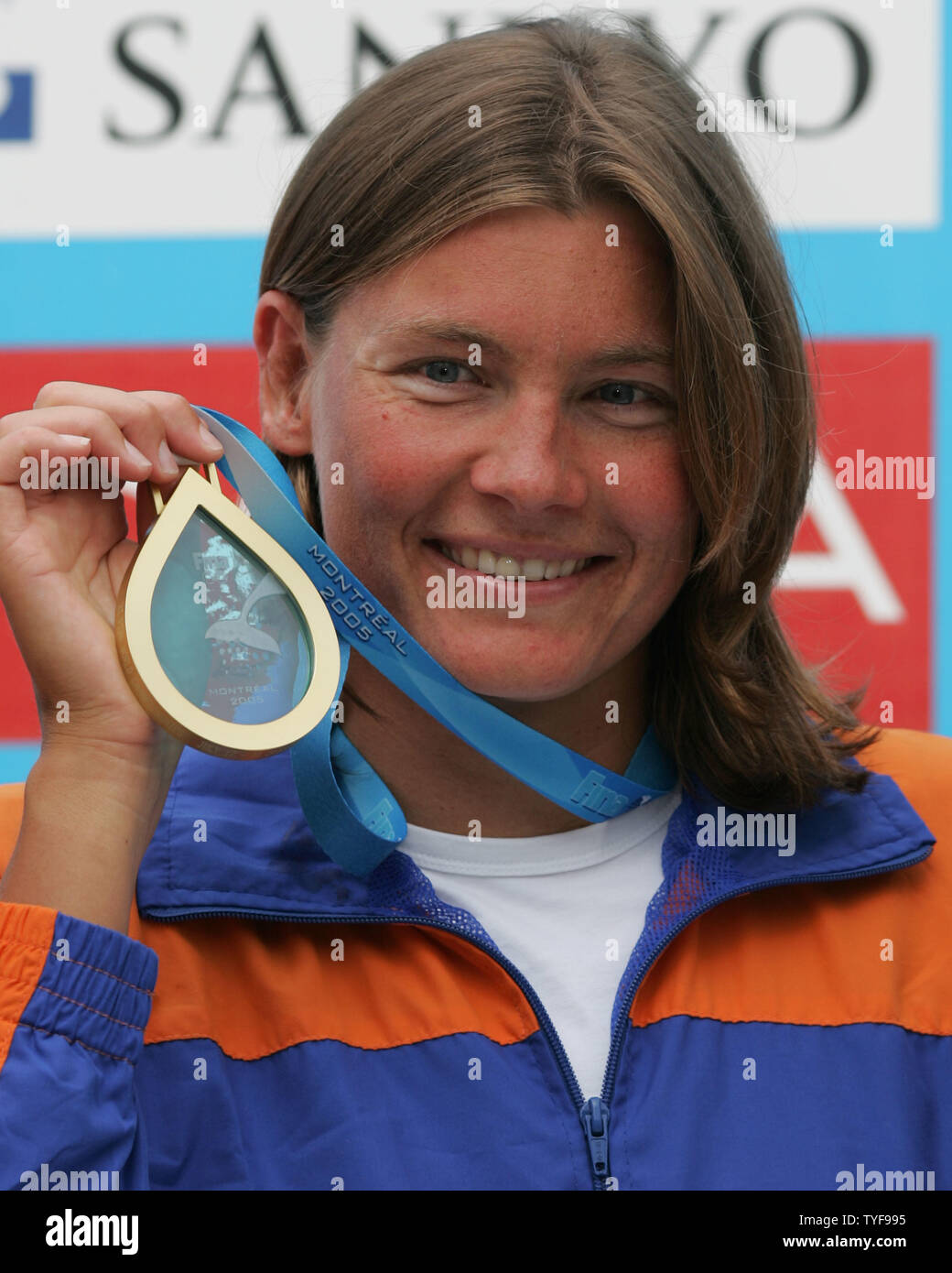 Dutch distance swimmer Edith Van Dijk brandishes her second gold medal ...