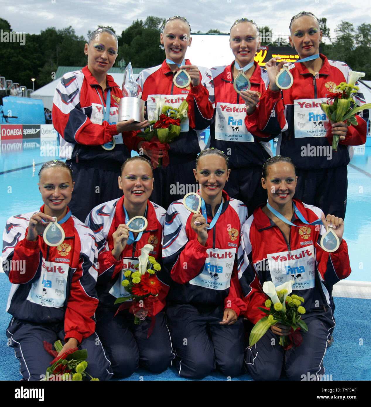 The Russian synchronized swimming team display their gold medals and ...