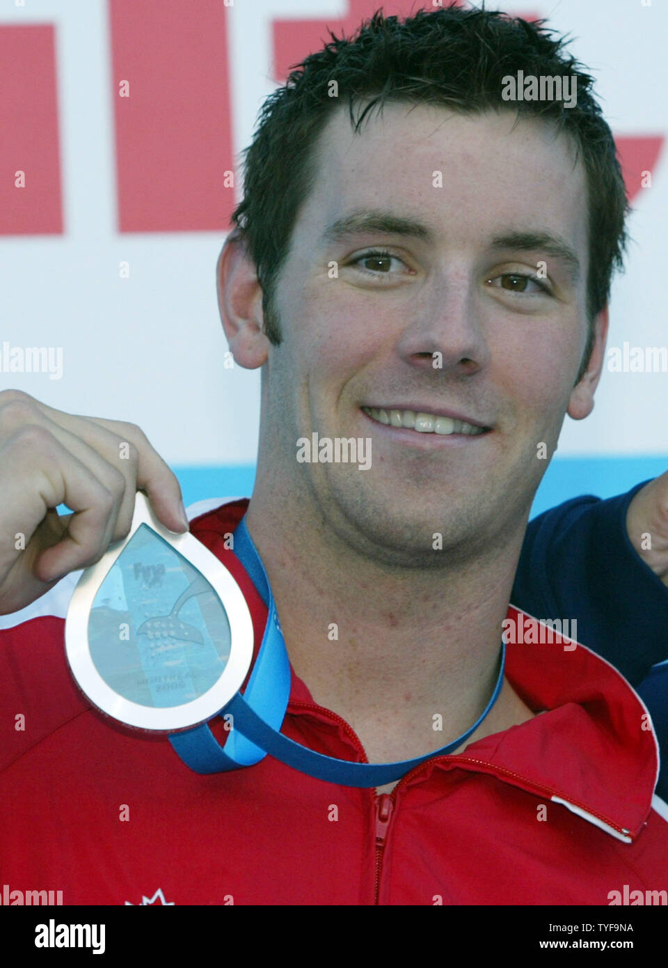 Canadian swimmer Mike Brown brandishes his first world medal, a silver ...