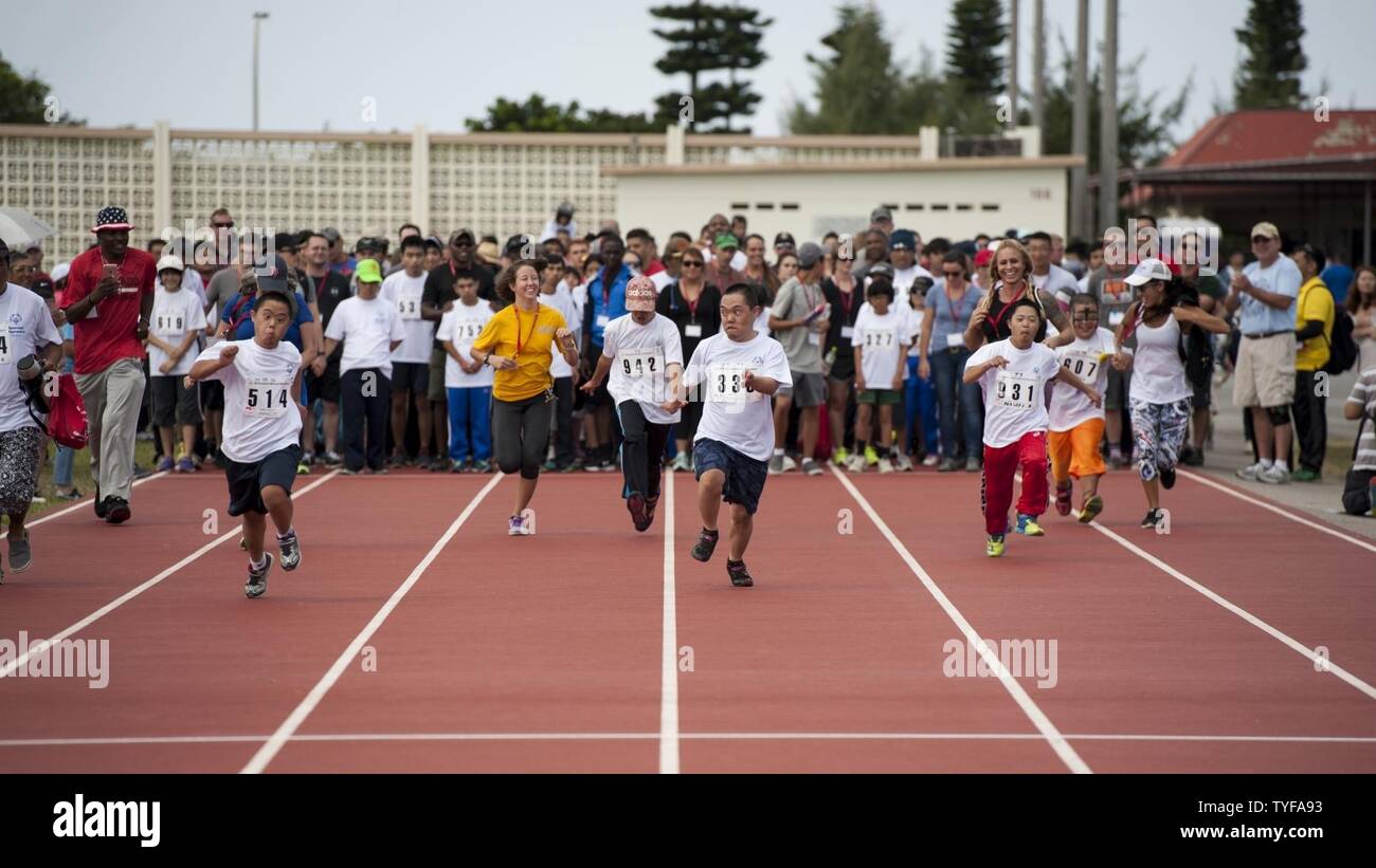 Special-needs athletes and their Brave Buddies run a 50-meter dash ...