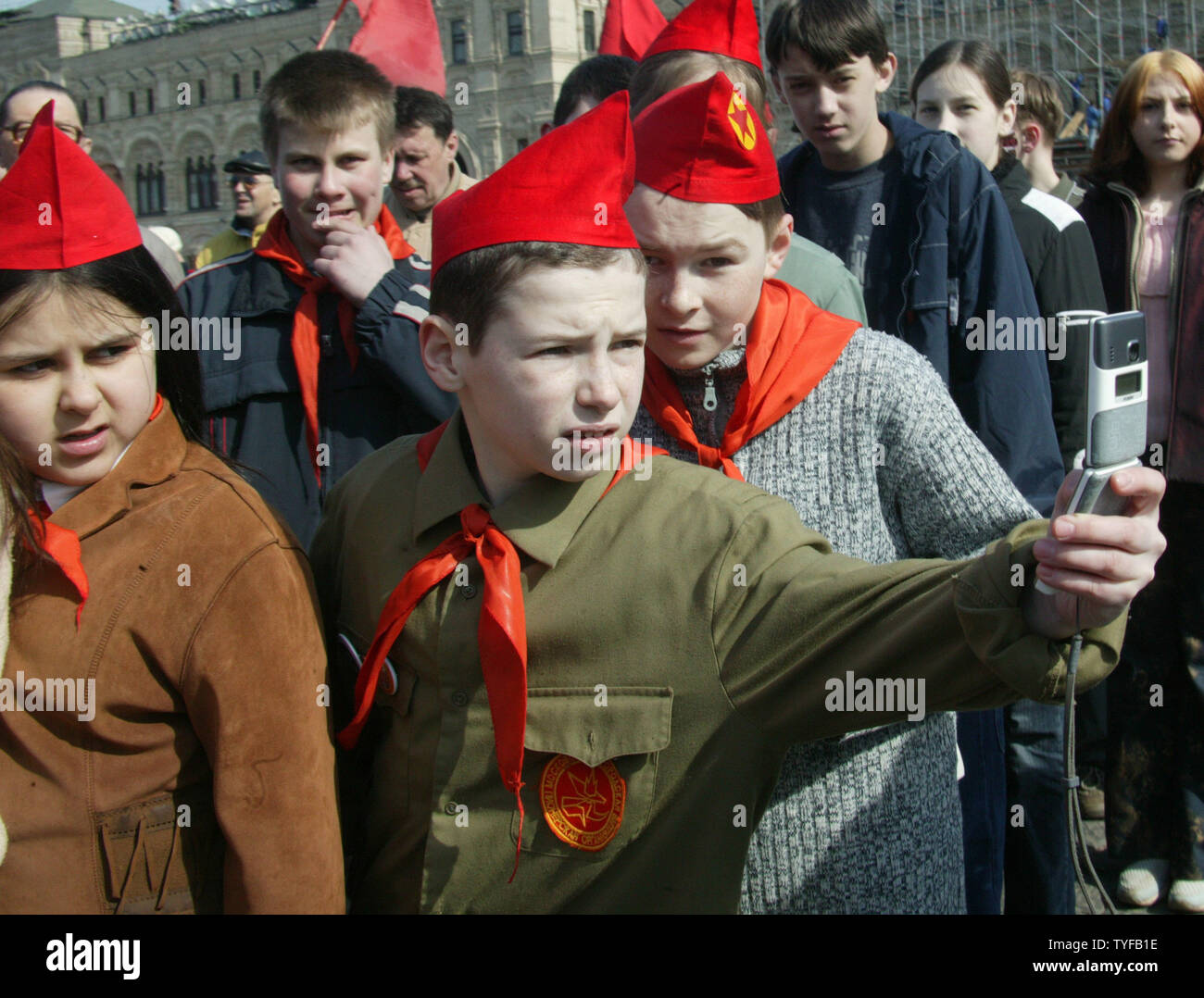 Russian young Communist supporters in Soviet caps and ties celebrate ...