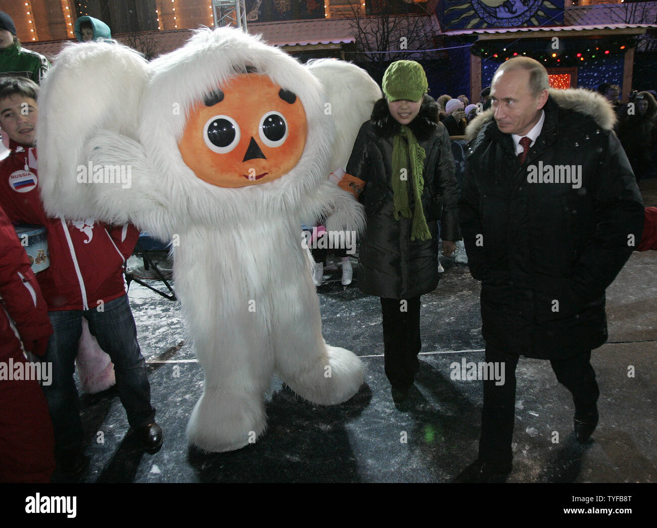 Russian President Vladimir Putin walks to greet children skating on an ...