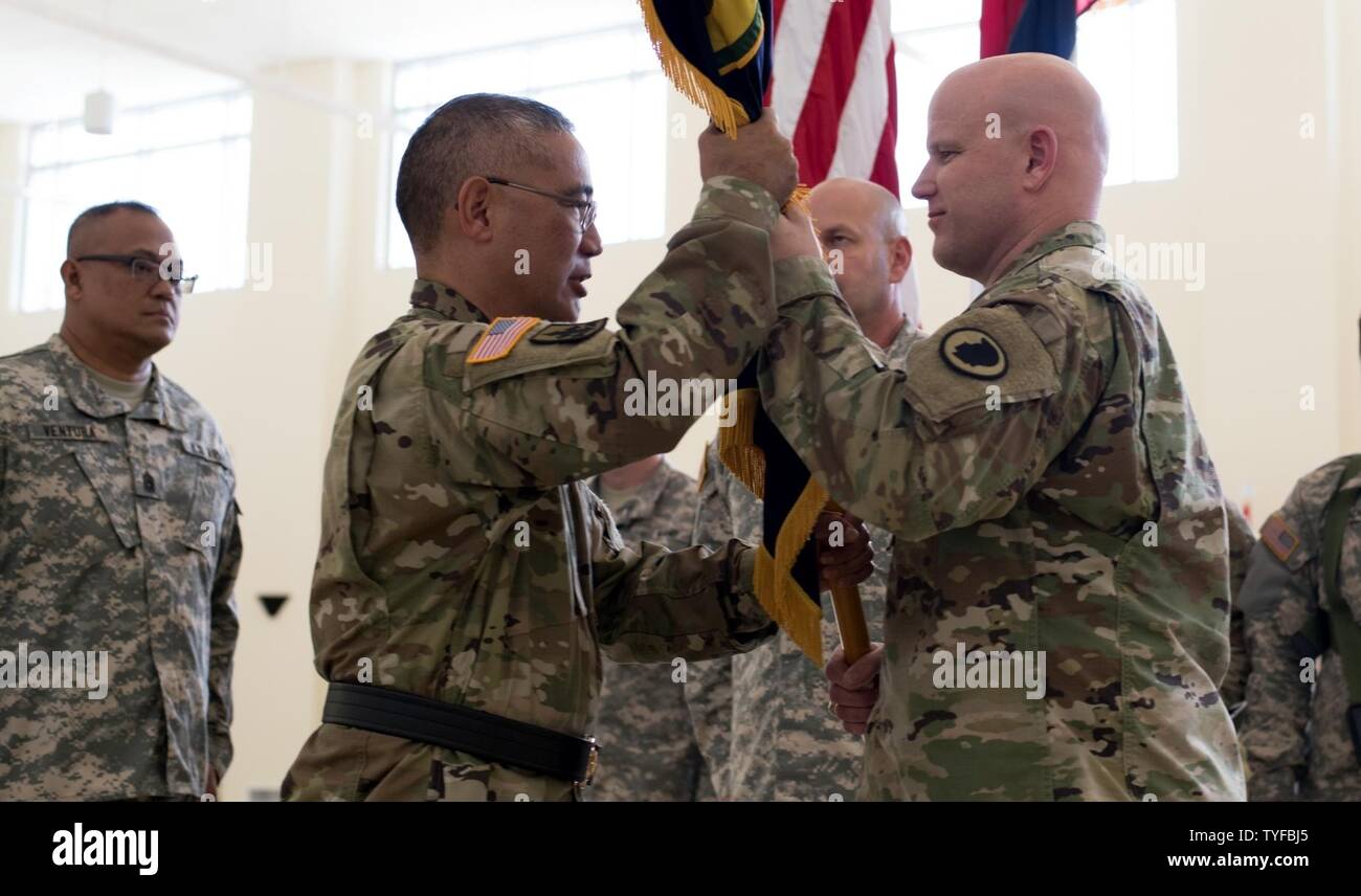 Command Sgt. Maj. Dana W. Wingad hands the Hawaii Army National Guard ...