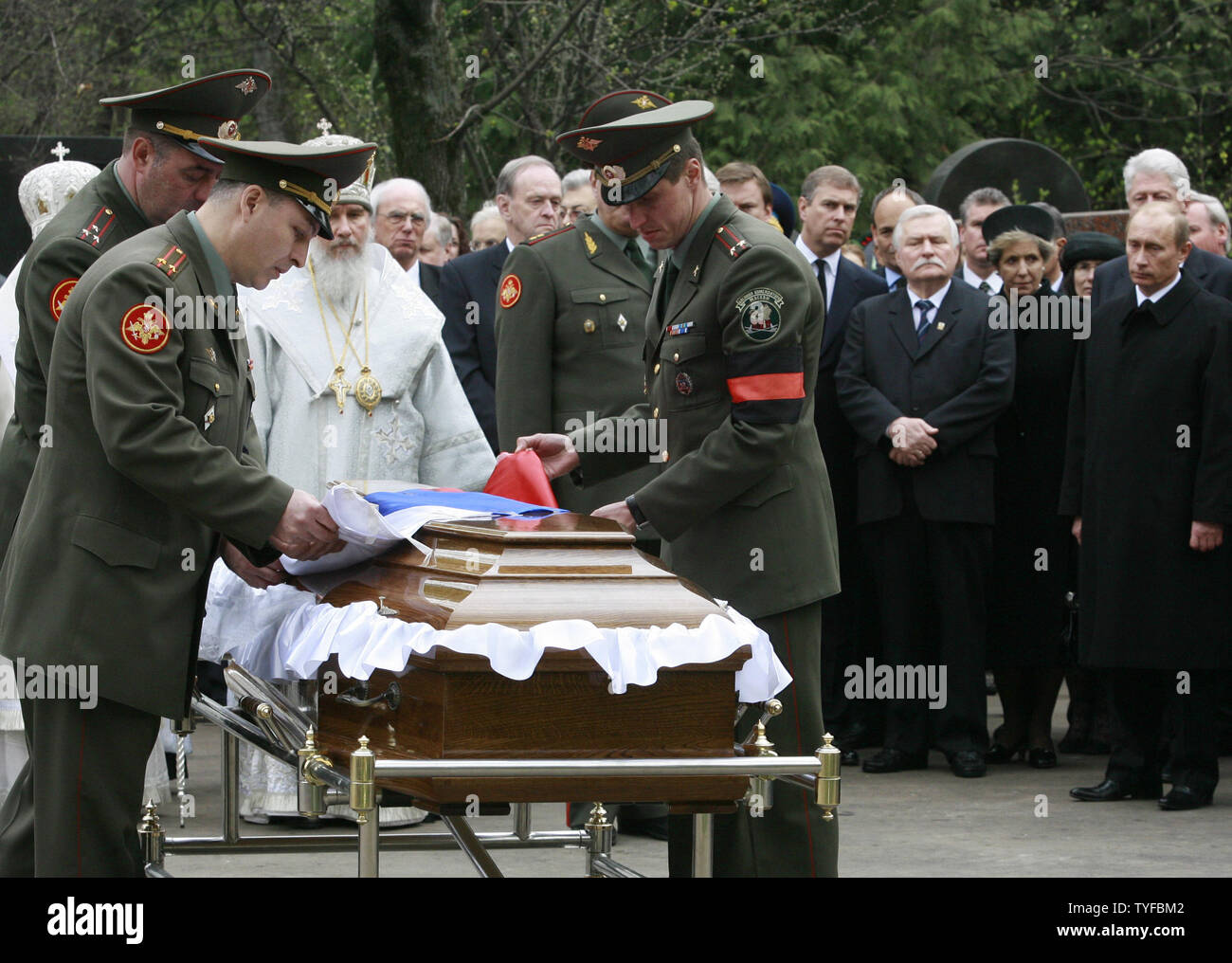 Russian President Vladimir Putin (R) with dignitaries and family ...