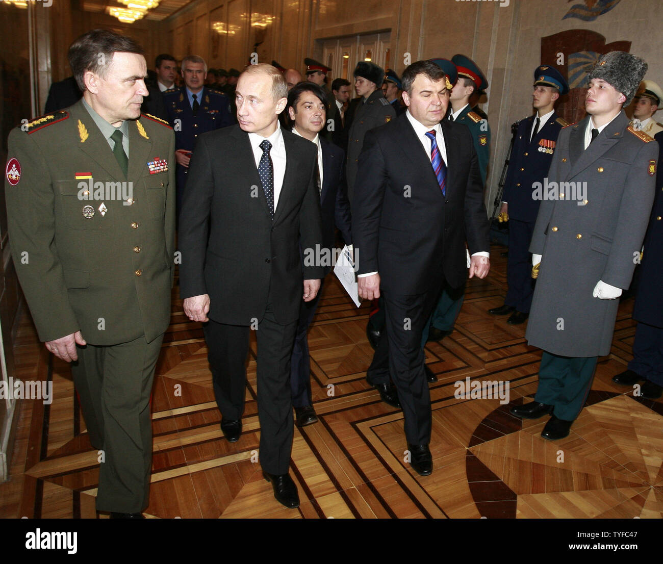 Russian President Vladimir Putin (C), deputy defense minister Vladimir ...
