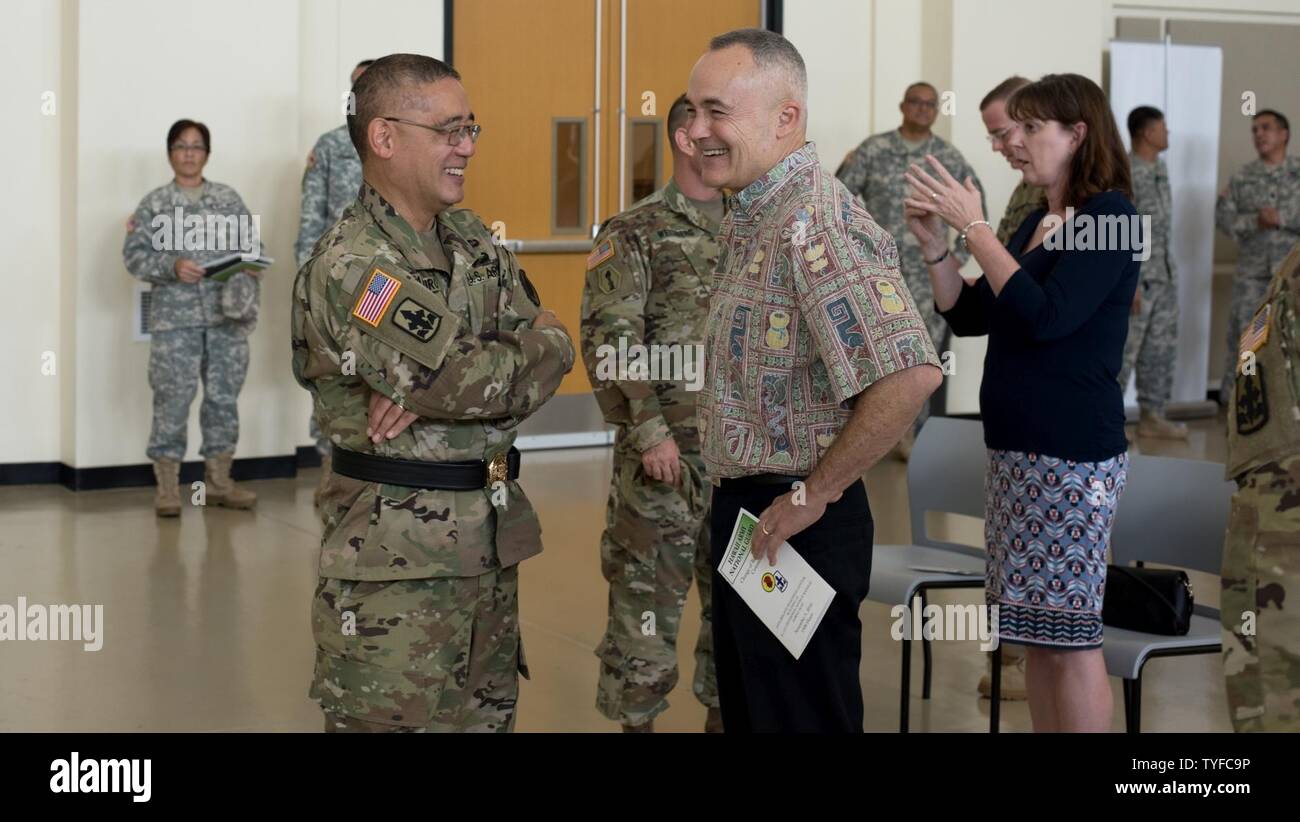 Brig. Gen. Keith Y. Tamashiro greets Maj. Gen. Bruce E. Olivera (ret ...