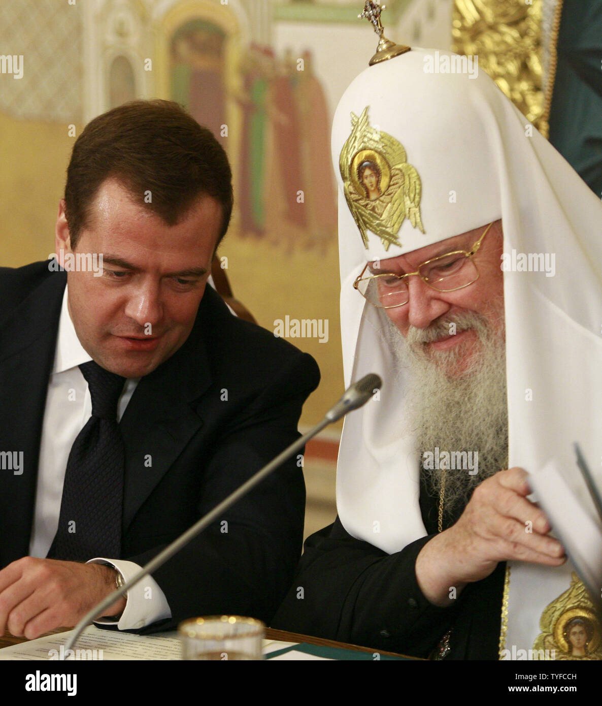 Russian Orthodox Patriarch Alexy II (R) listens to president-elect ...