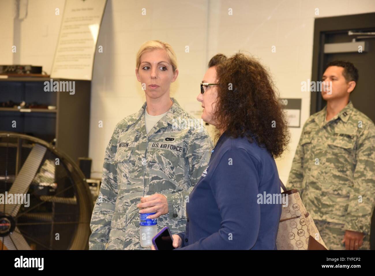 Bethany Butler, from Navy Federal Credit Union, visits with her ...