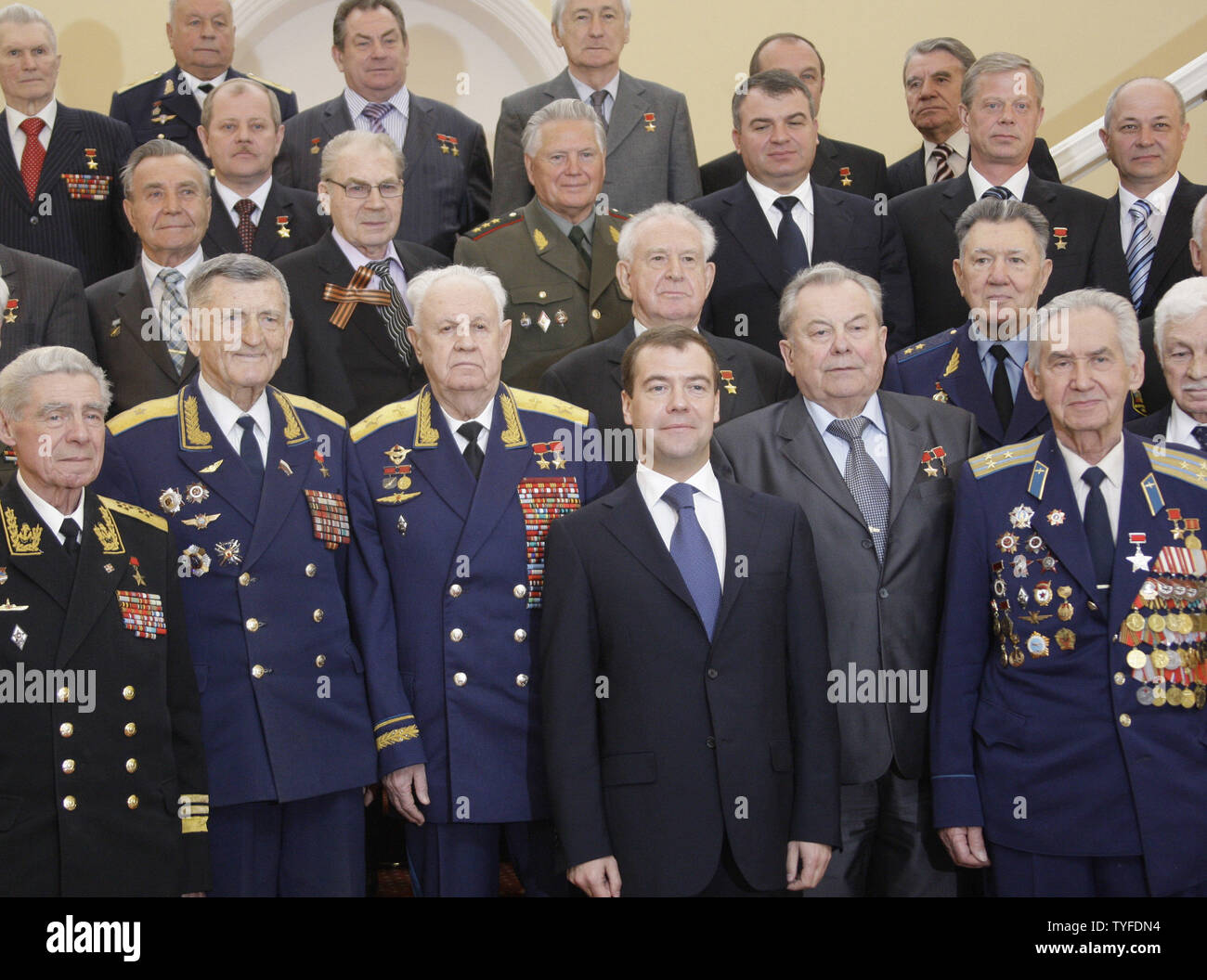 Russian President Dmitry Medvedev (C) poses for a group photo with ...
