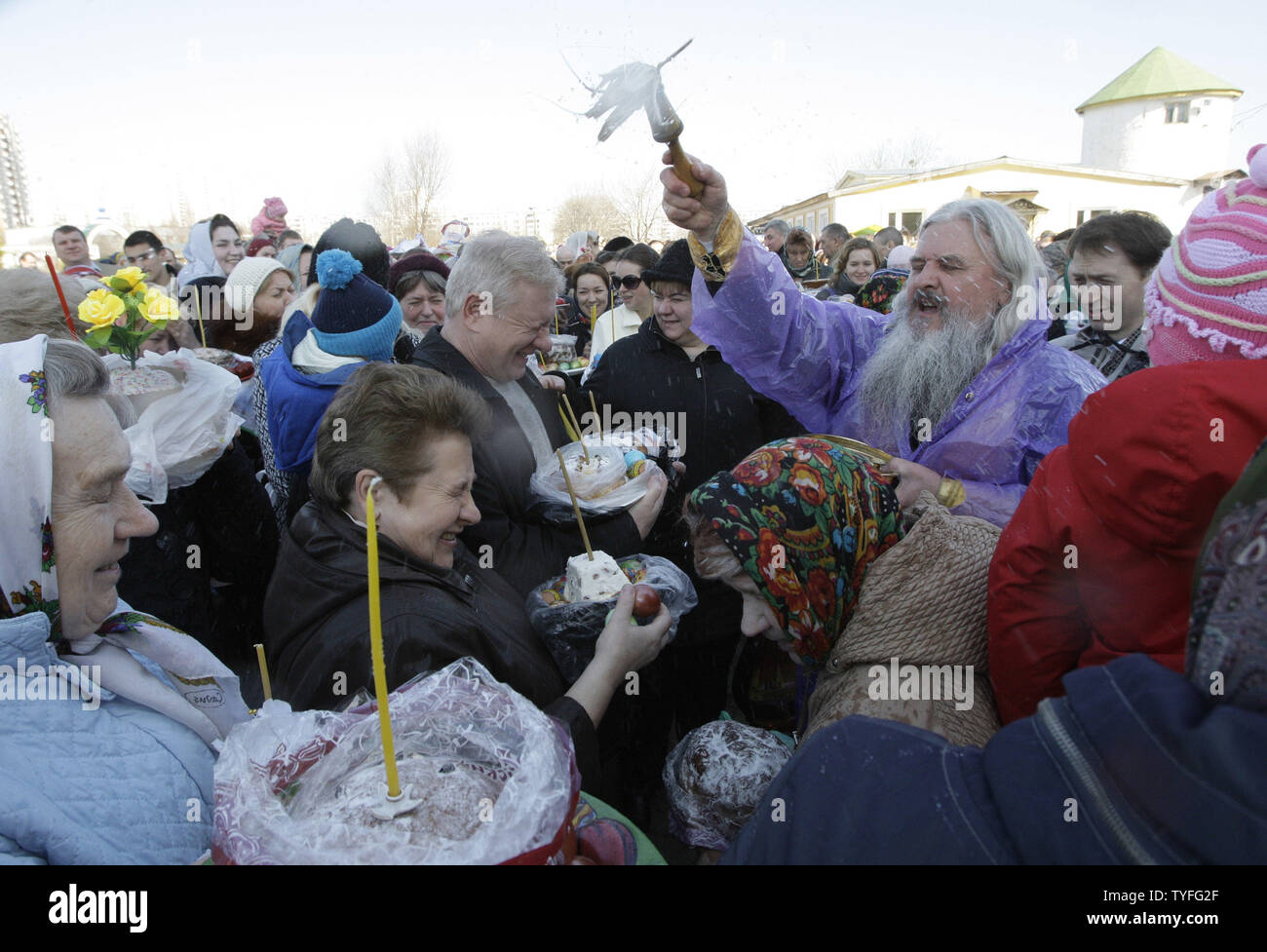 A Russian Orthodox priest blesses traditional Easter cakes and painted ...