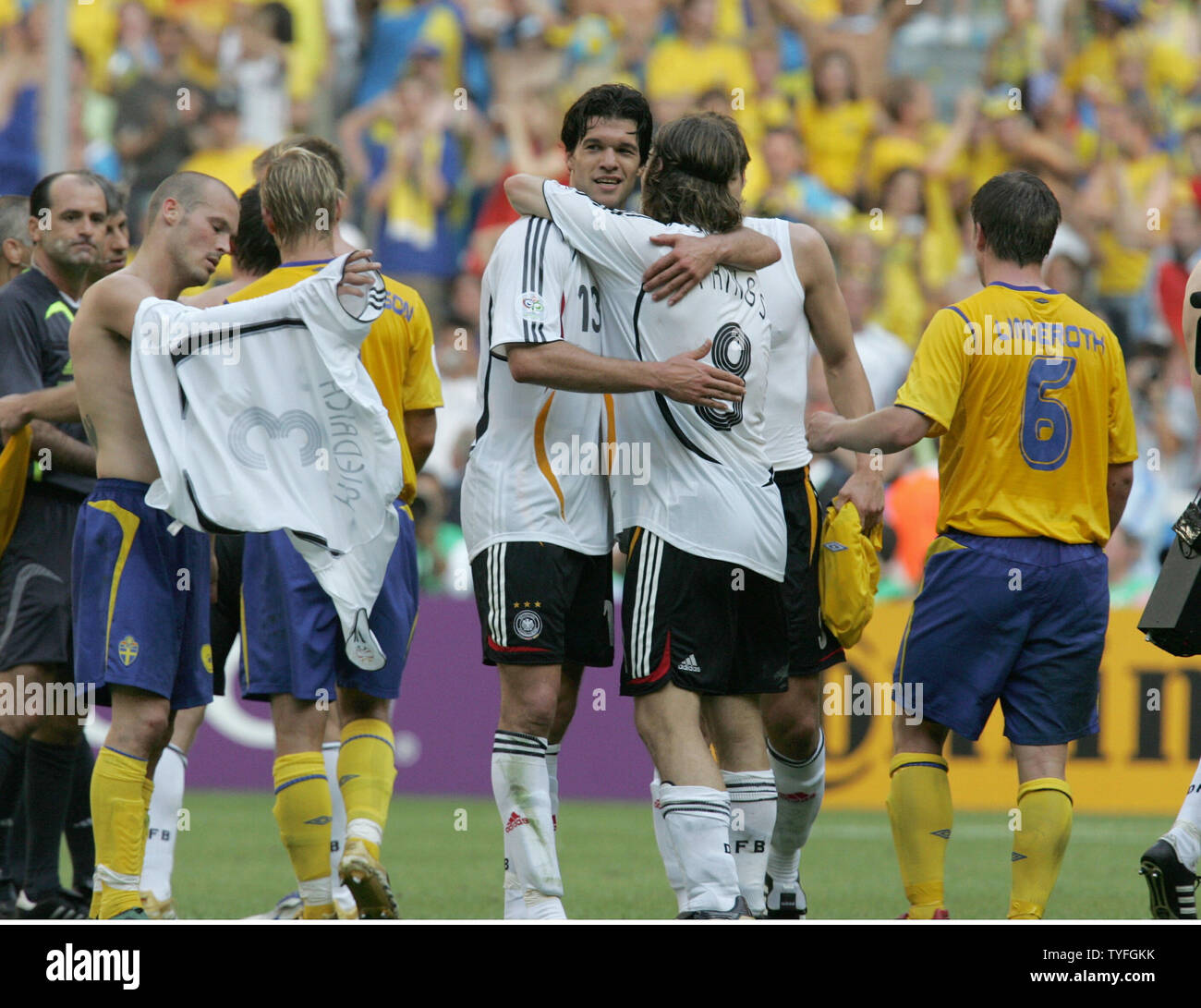 Michael Ballack hugs Arne Frings during the German team's final ...