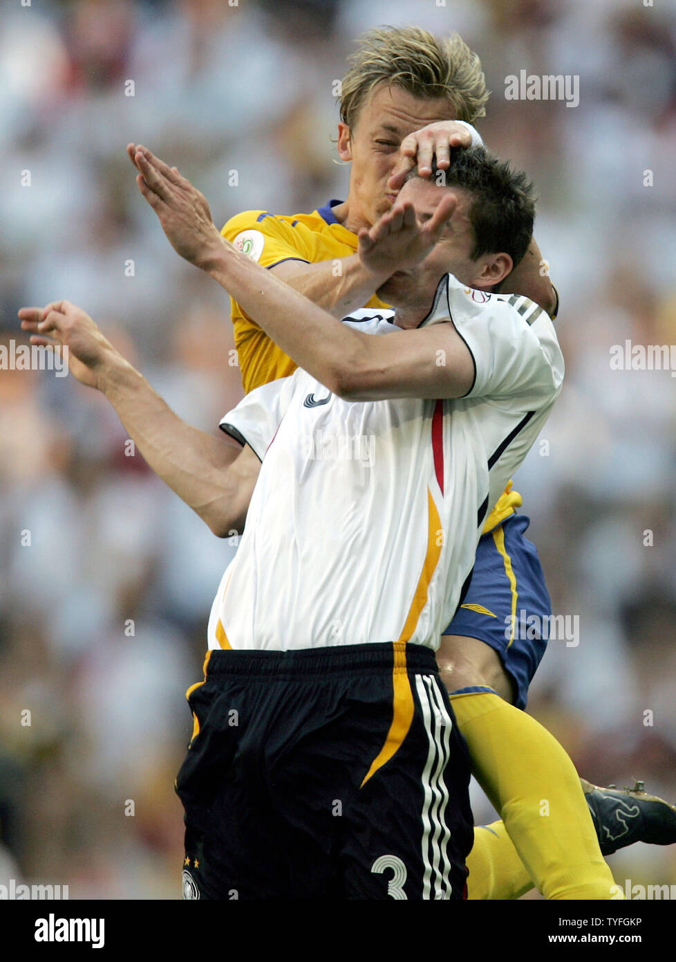 Swedish player Erik Edman (L) jumps on Arne Friedrich of Germany in the ...