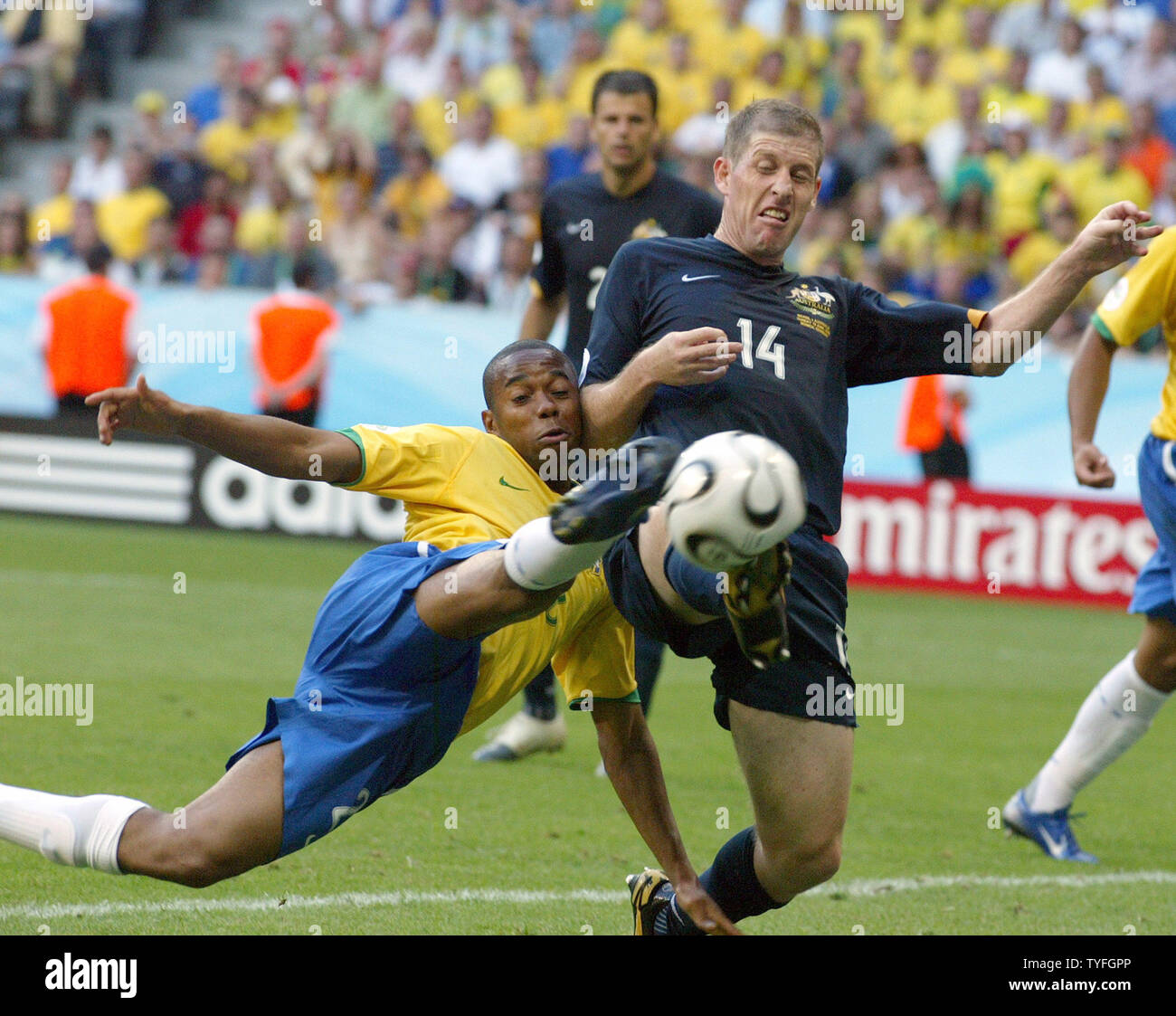 Brazil's Robinho (23) fights with Australia's Scott Chipperfield (14 ...