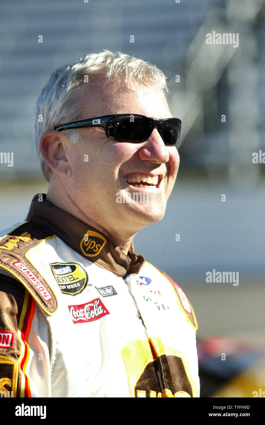 Race car driver Dale Jarrett talks on pit road before his run at ...