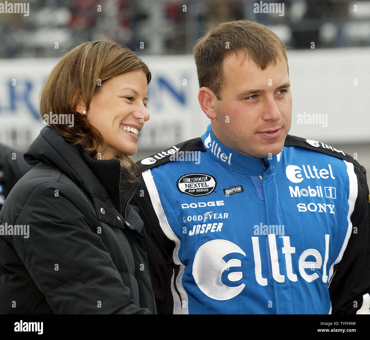 Ryan Newman, right, and his wife Krissie Newman stand on pit road ...