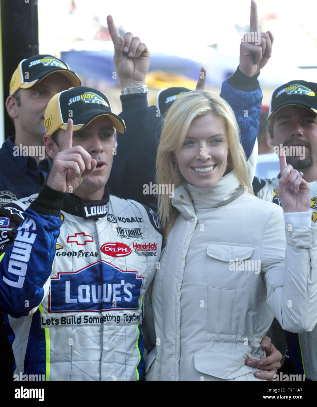 Jimmie Johnson and his wife Chandra celebrate Johnson's victory in the ...