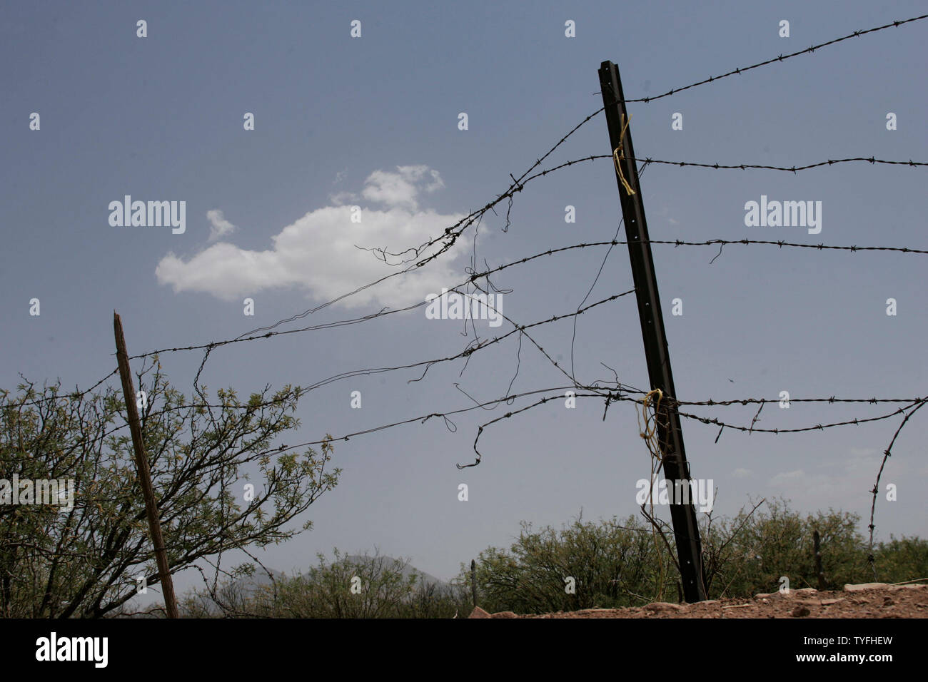 A hole in the border fence has been cut to assist illegal immigrants ...