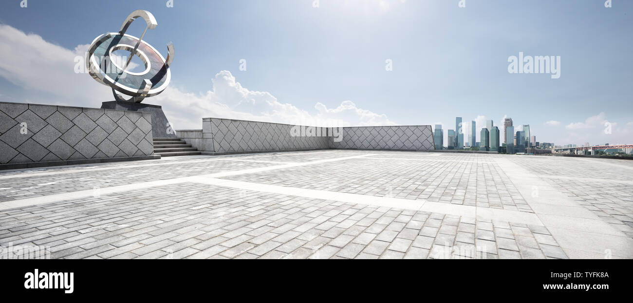 empty floor and modern city in sunny sky Stock Photo - Alamy