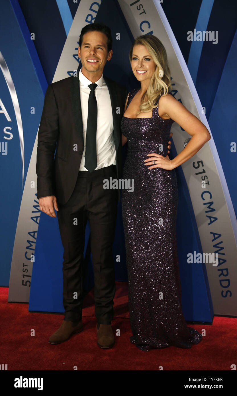 Granger Smith and his wife Amber Bartlett walk the red carpet as they ...