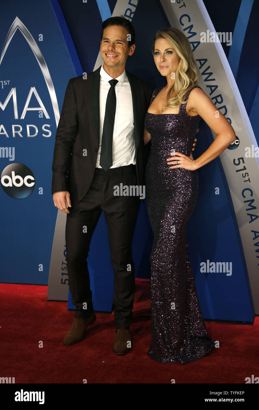 Granger Smith and his wife Amber Bartlett walk the red carpet as they ...