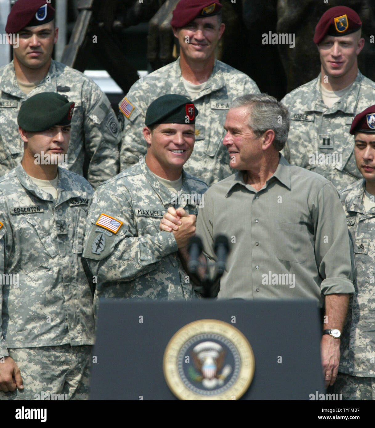 President George Bush, right, shakes hands with staff sgt. Charles ...