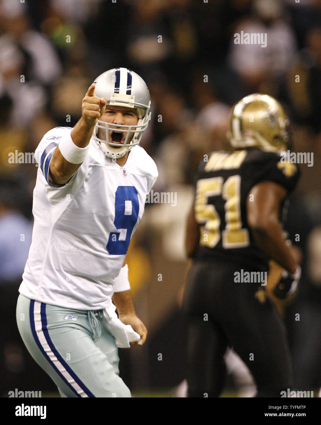 Dallas Cowboys quarterback Tony Romo (9) celebrates after throwing a ...