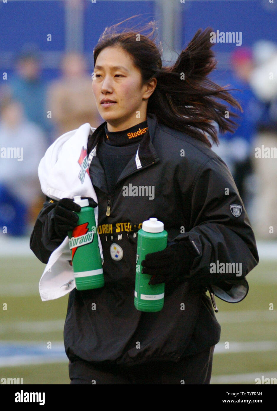 Pittsburgh Steelers assistant trainer Ariko Iso runs off the field ...
