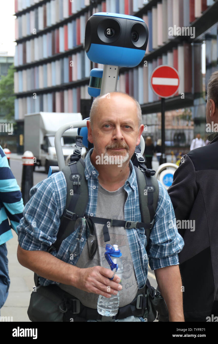 google street view walker trekker Stock Photo - Alamy