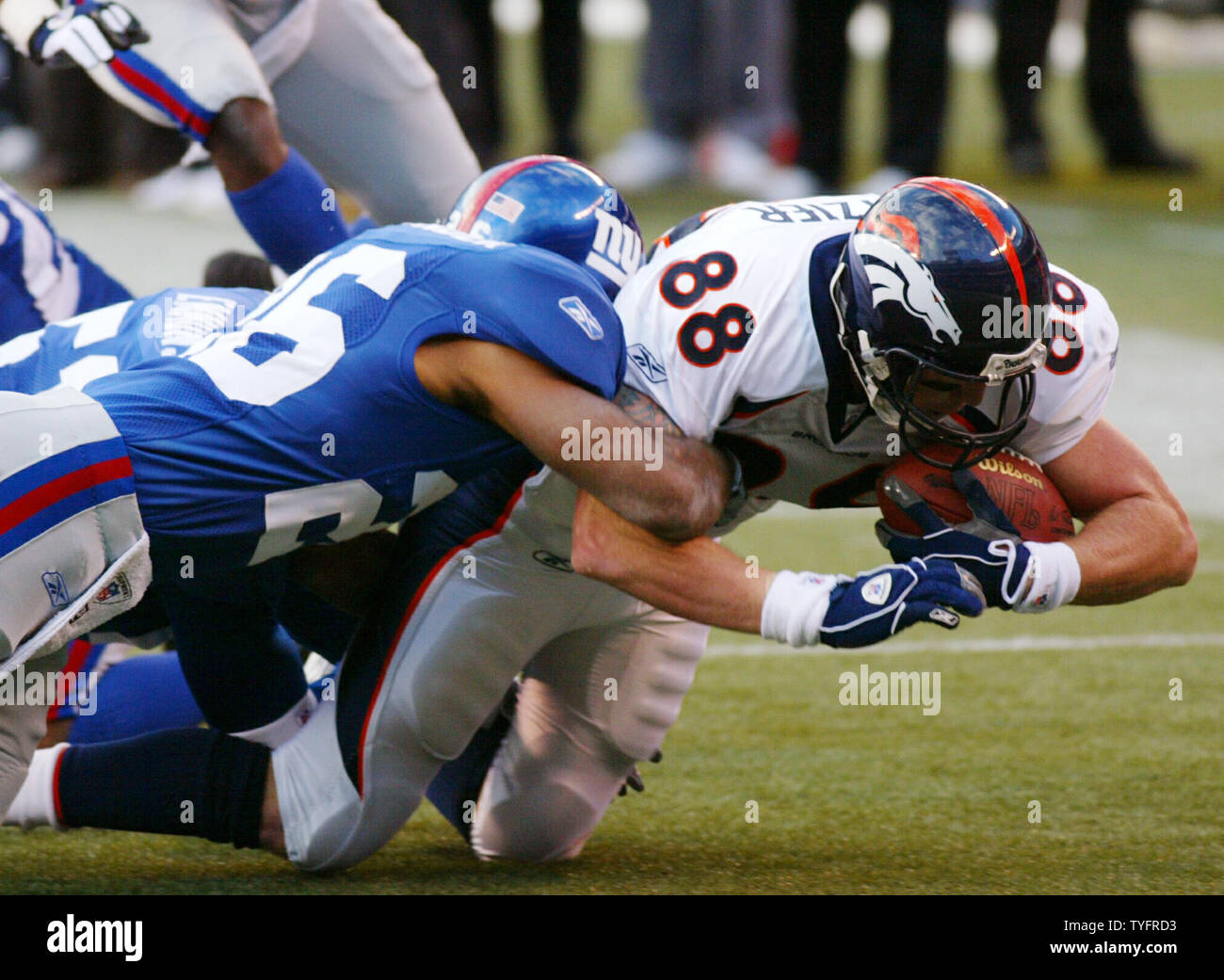 Denver Broncos Jeb Putzier dives for more yards. The New York Giants ...