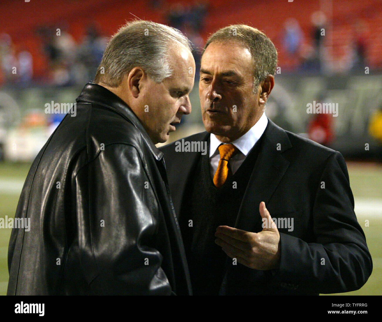 Al Michaels and Rush Limbaugh talk on the field before the New York ...