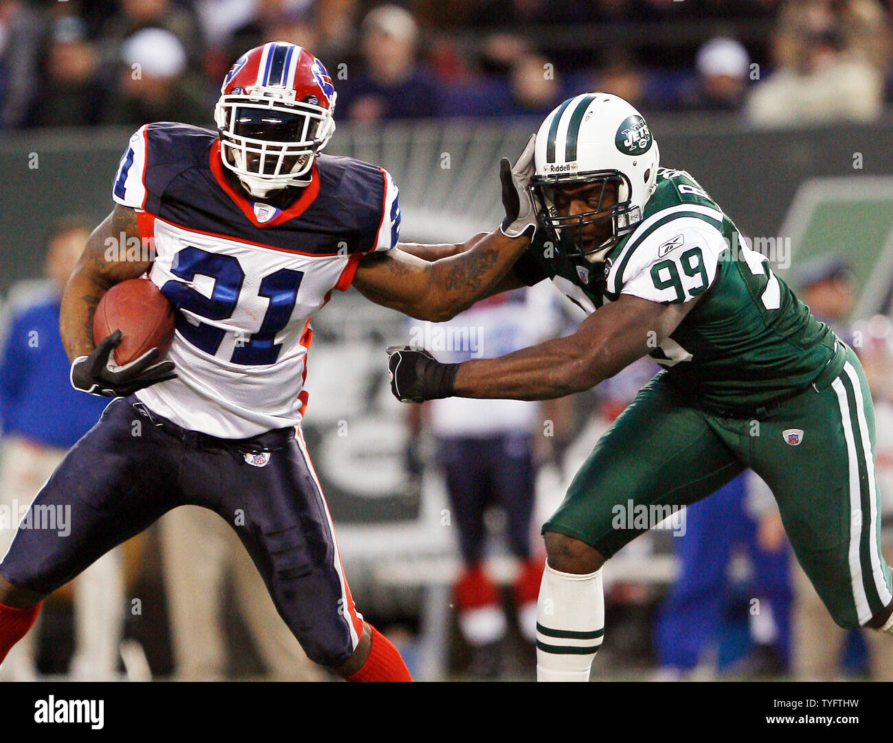 Buffalo Bills Willis McGahee (21) stiff arms New York Jets Bryan Thomas ...