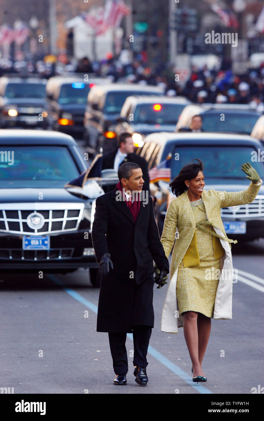 U.S. President Barack Obama and First Lady Michelle Obama wave while ...