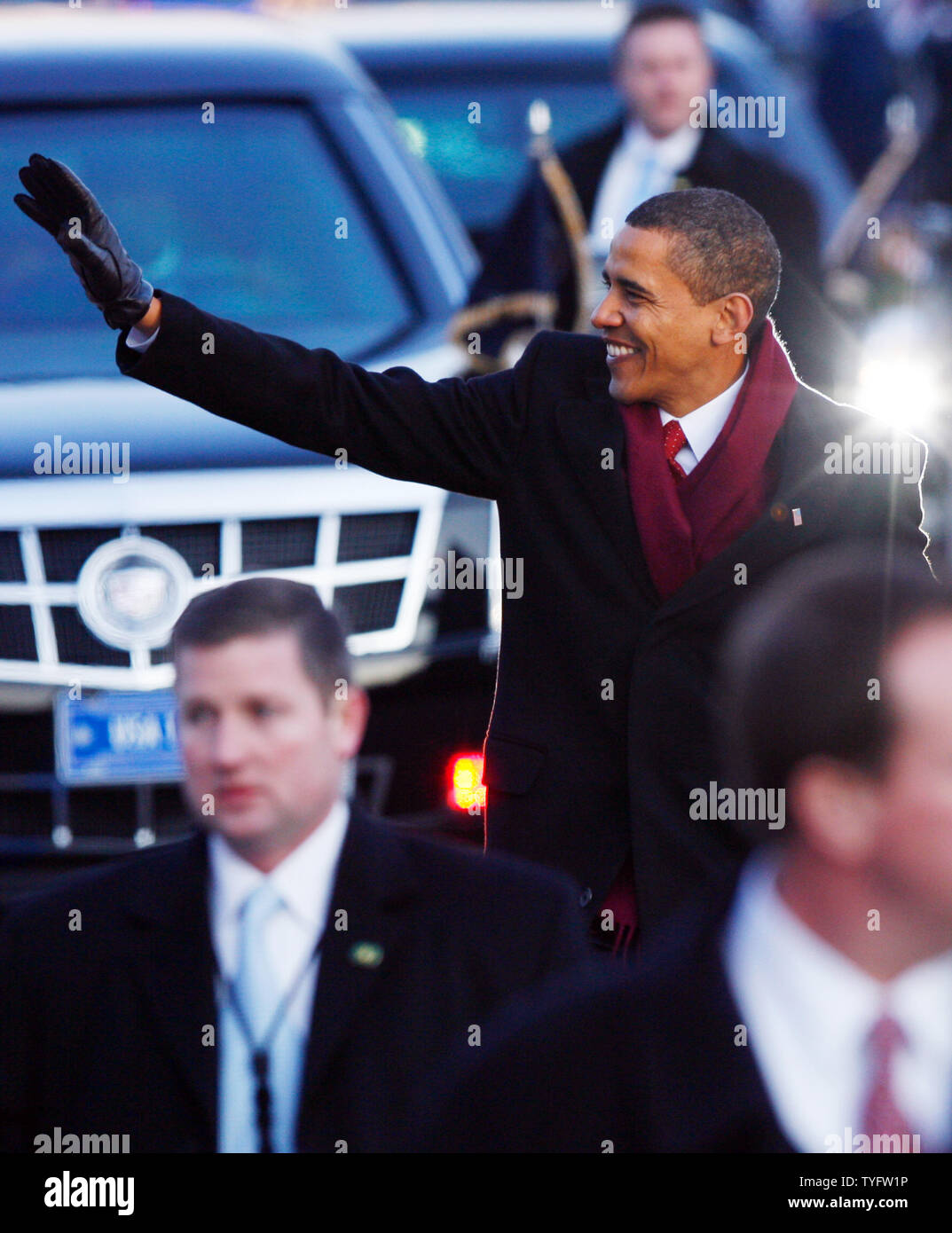 U.S. President Barack Obama waves while walking the parade route after ...