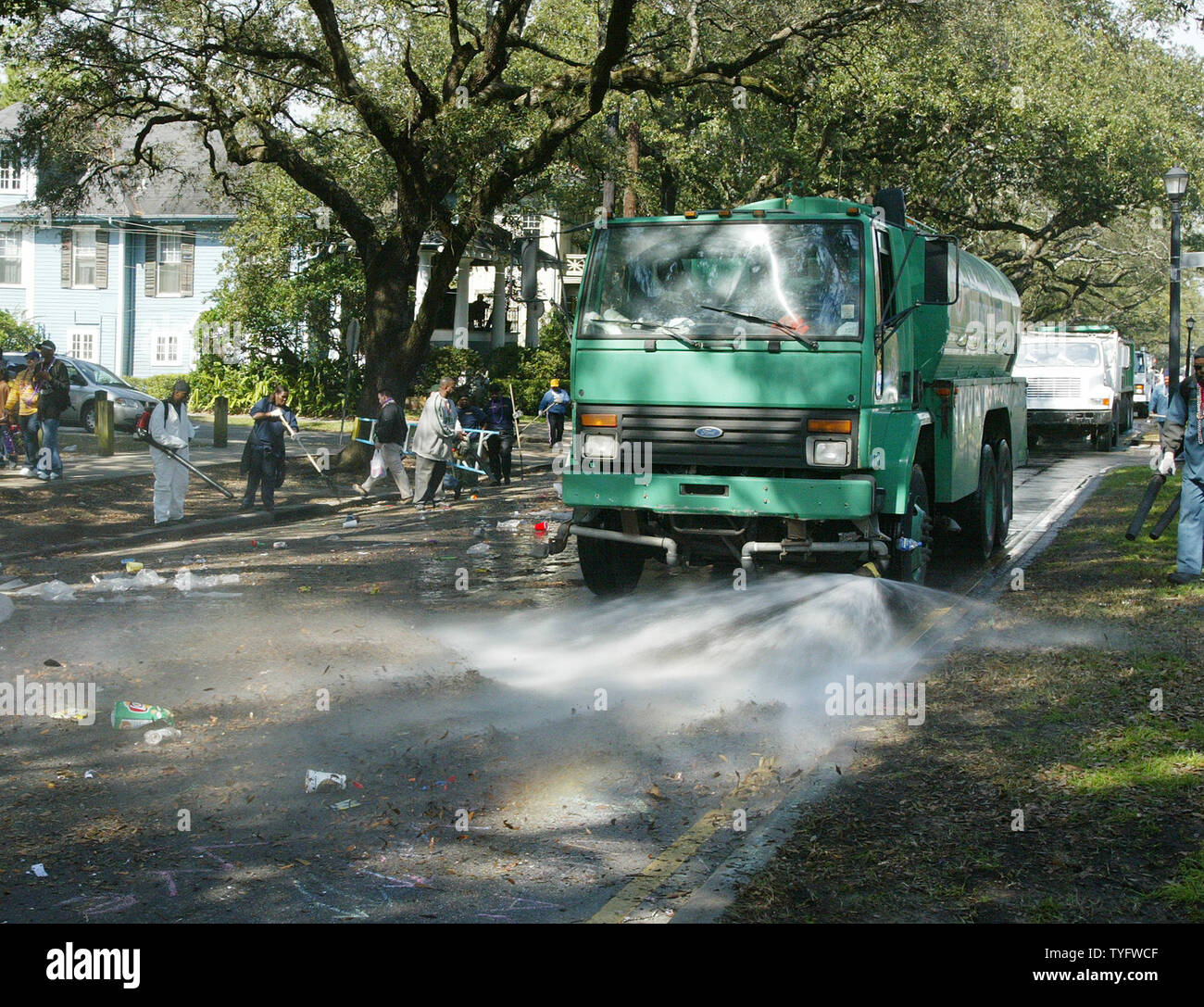 Street sweepers spray and scour the wide expanses of Napoleon Avenue in ...