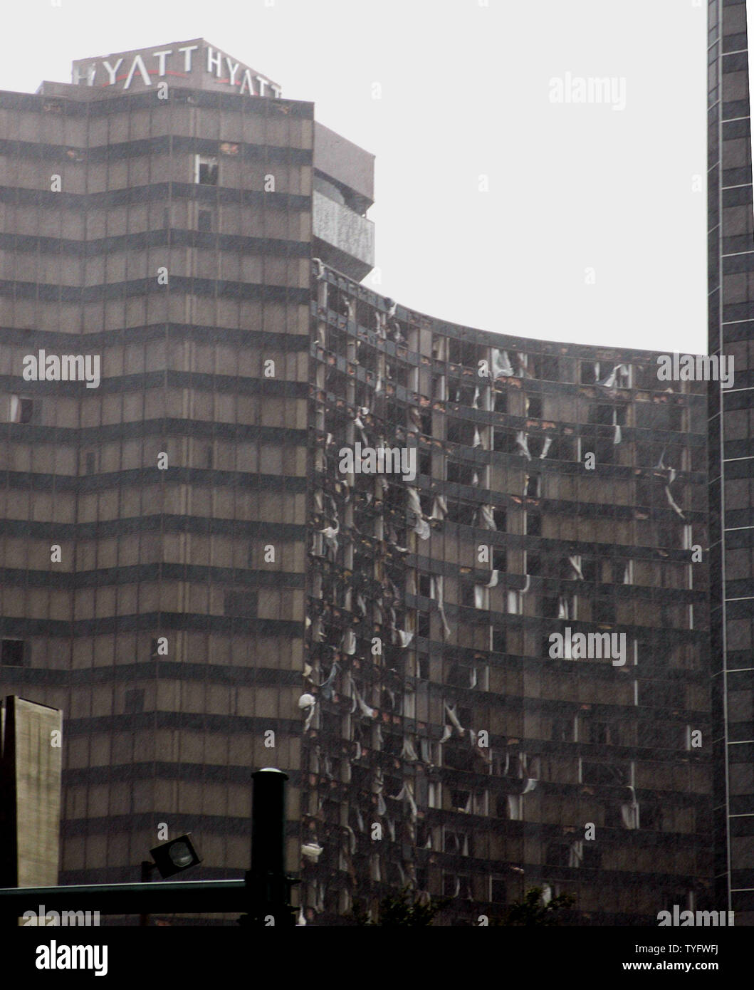 Drapes hang in midair after windows were blown out of the Hyatt Regency ...