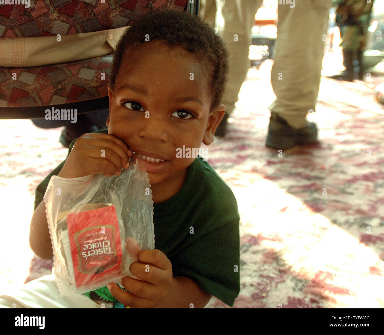 Hurricane Katrina refugee Kevin Adams, aged 2, chews on a baggie at the ...