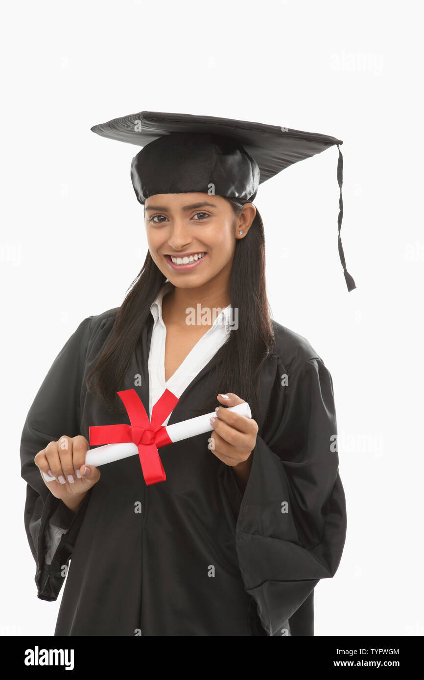 Indian university student holding graduation degree Stock Photo - Alamy