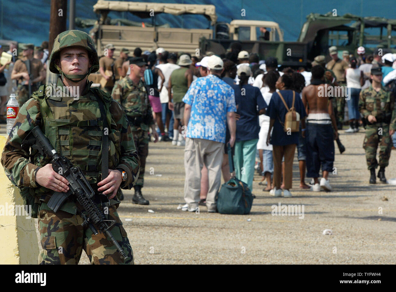 National Guard troops oversee feeding thousands of refugees from ...