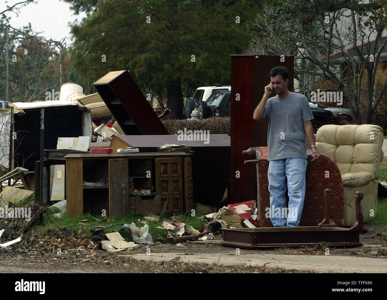 Lakeview resident Todd Rancatore talks on his cell phone while standing ...
